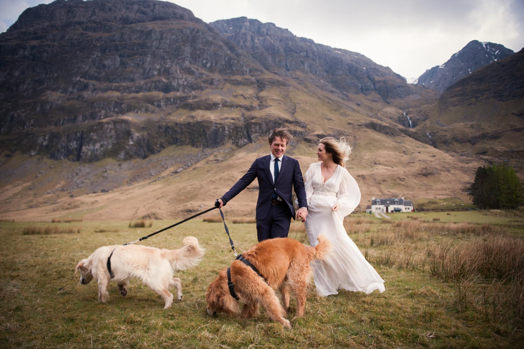 A brand groom and their dogs walk through the Scottish Highlands for ...